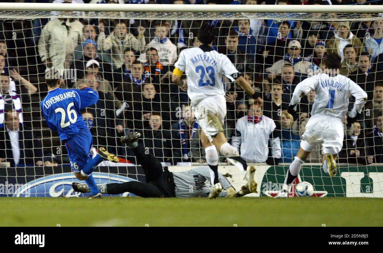 Rangers' Peter Lovenkrands (l) scores the equalising goal against Inter ...