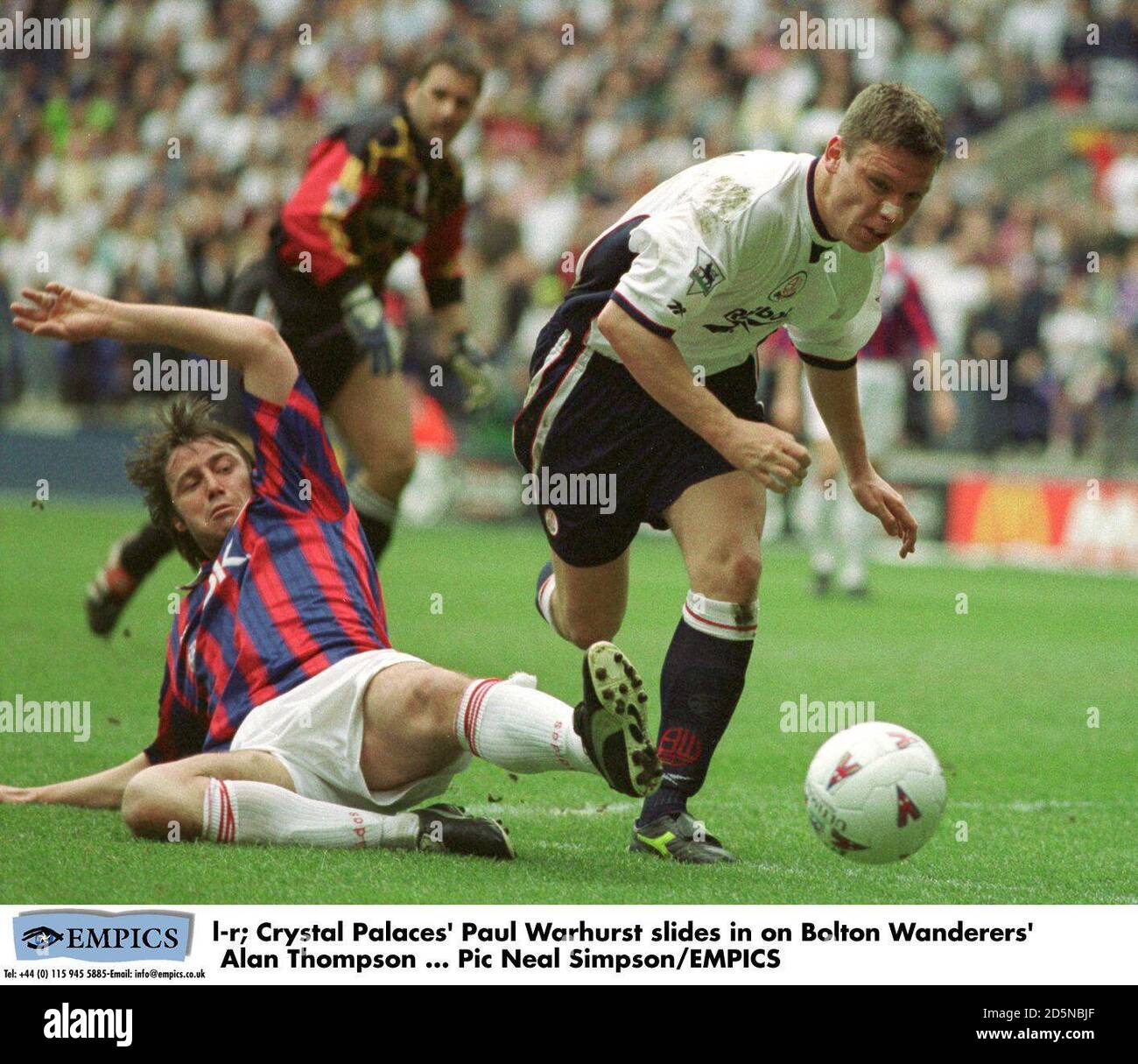 l-r; Crystal Palaces' Paul Warhurst slides in on Bolton Wanderers' Alan ...