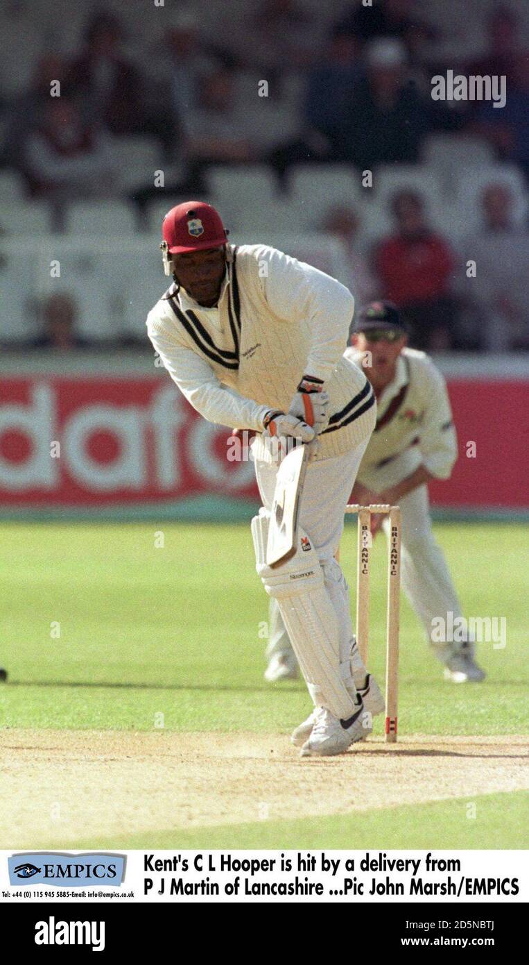 Kent's Carl Hooper is hit by a delivery from Peter Martin of Lancashire ...