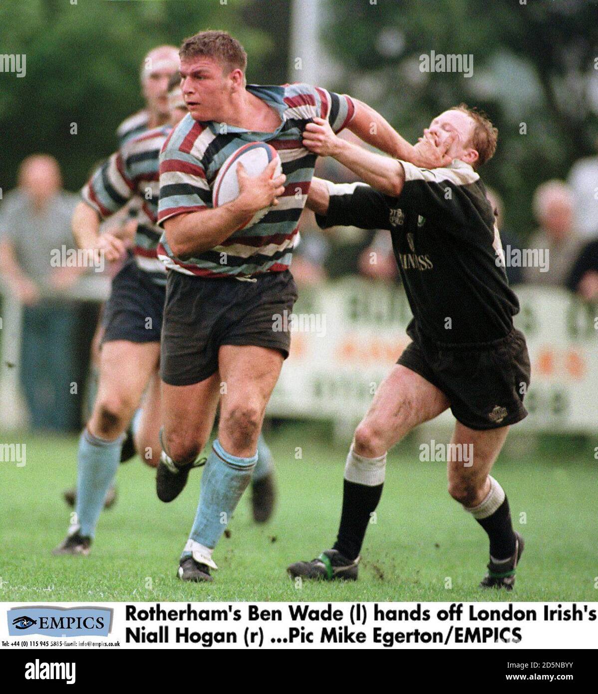 Rotherham's Ben Wade hands off London Irish's Niall Hogan Stock Photo ...