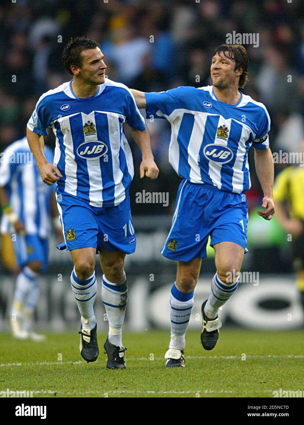 Wigan Athletic's Lee McCulloch celebrates his goal with Arjan De Zeeuw ...