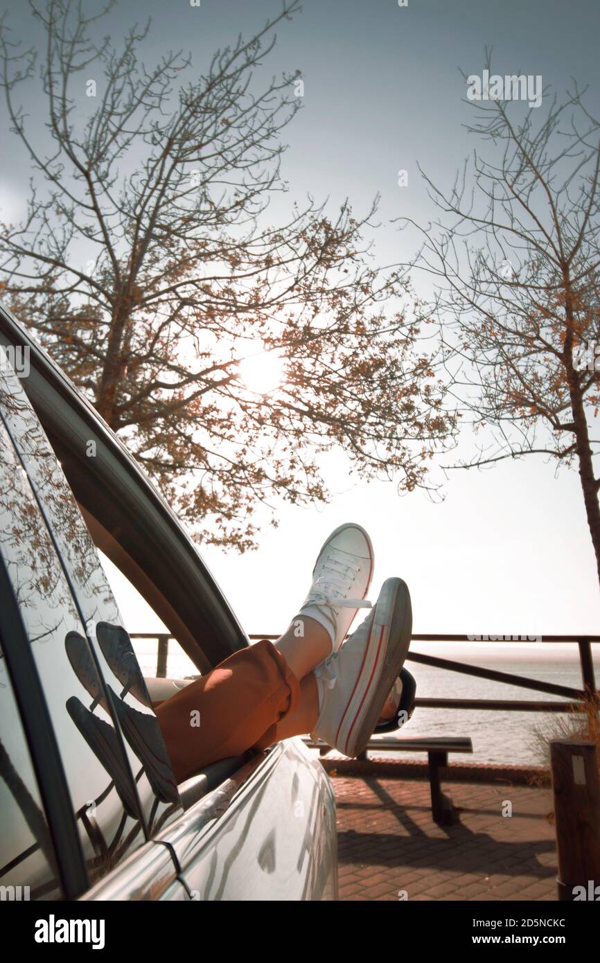 Girl feet sticking out the window enjoying the view Stock Photo - Alamy