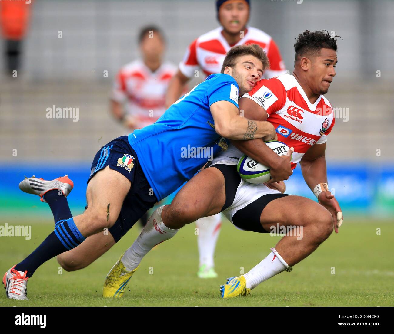 Japan's Ataata Moeakiola is tackled by Italy's Luca Sperandio (left ...