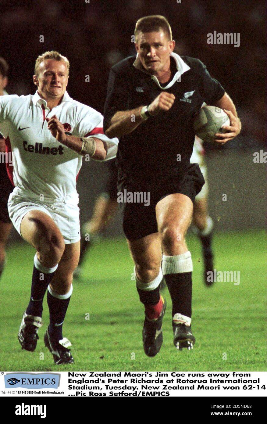 New Zealand Maori's Jim Coe (right) runs away from England's Peter ...
