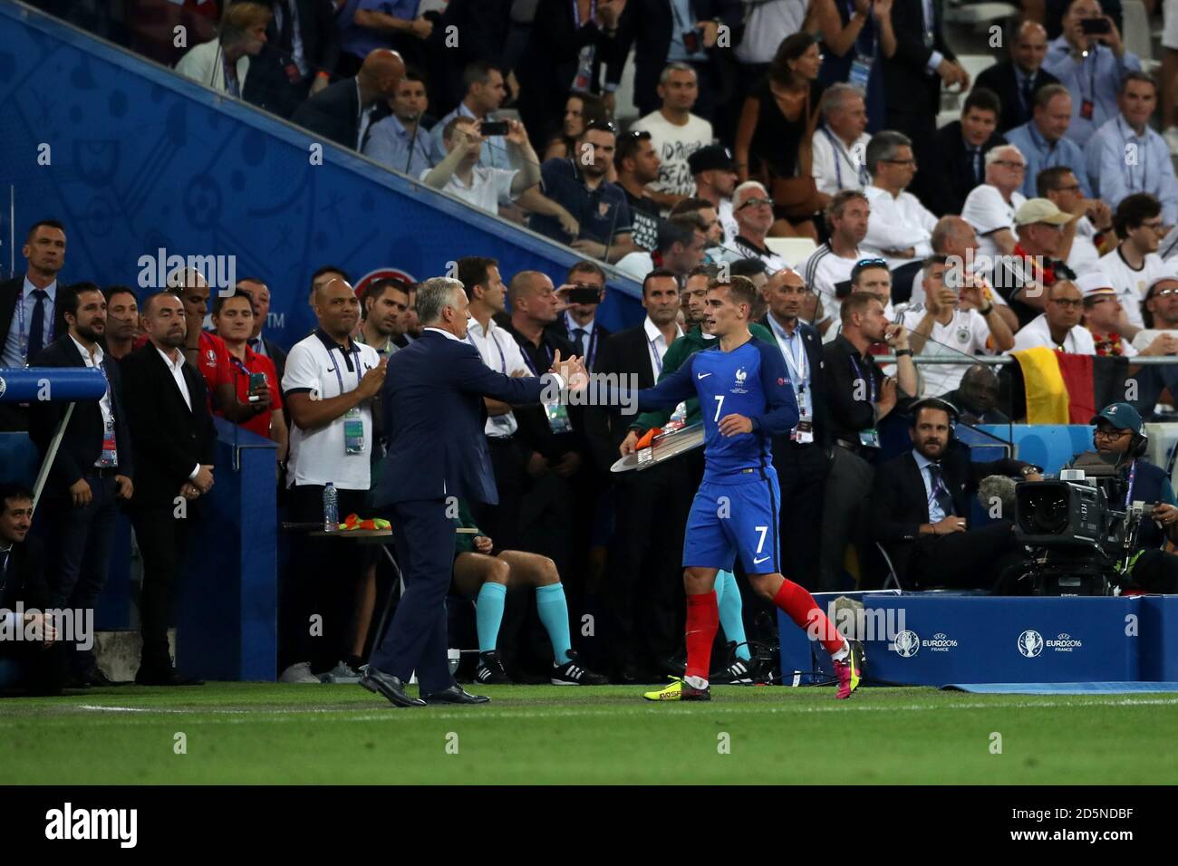 France's Antoine Griezmann shakes hands with manager Didier Deschamps ...