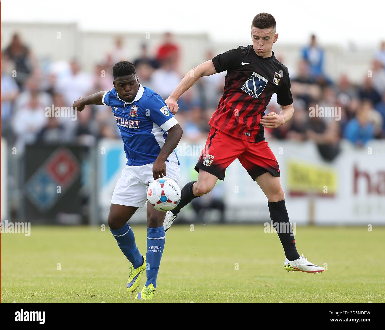 Nuneaton's Shaquille McDonald and Coventry City's Darragh Leahy (right ...