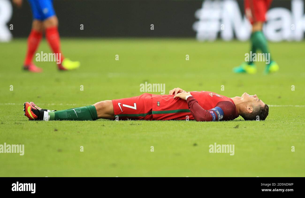 Portugal's Cristiano Ronaldo collapses to the ground injured early in ...