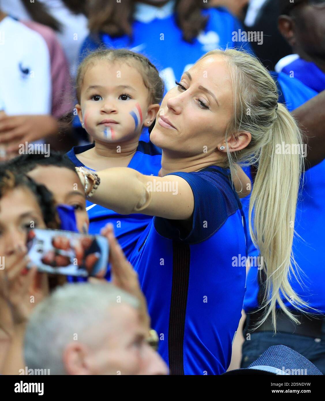 Sandra Evra, wife of France's Patrice Evra with their daughter Maona in ...