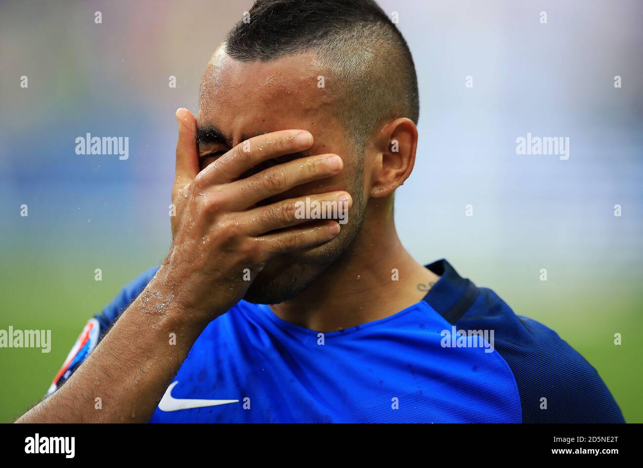 France's Dimitri Payet rubs water on his face Stock Photo - Alamy