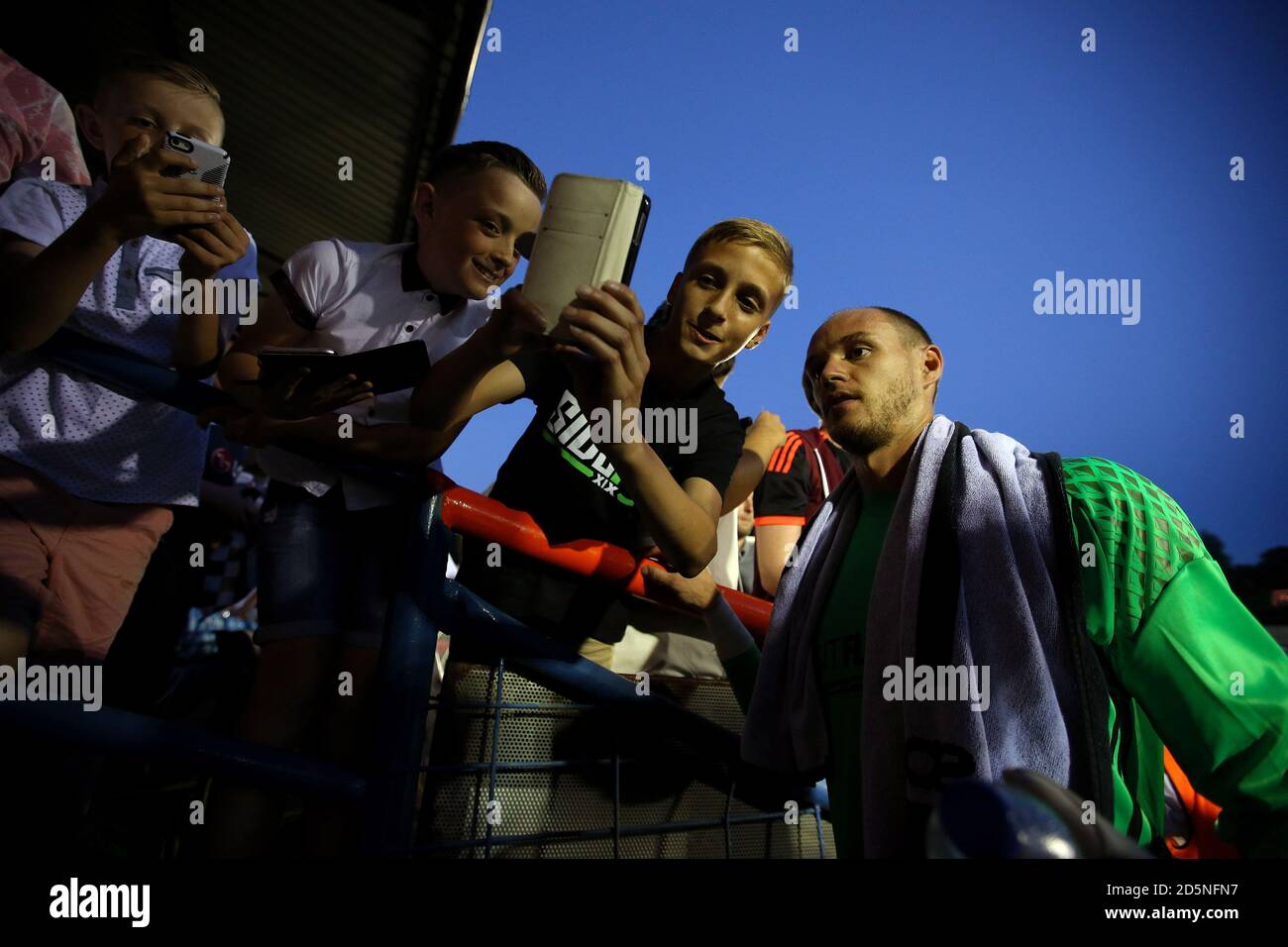 Fulham's David Button poses for selfie with fans after the game Stock ...