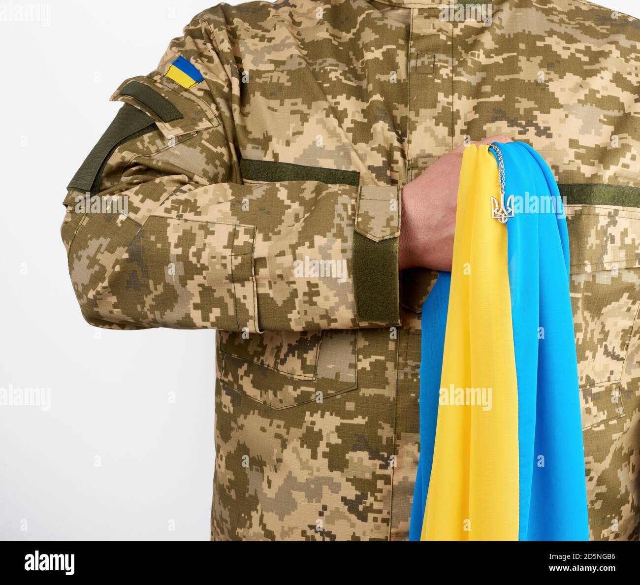 Ukrainian man warrior dressed in a military pixel uniform holds the ...