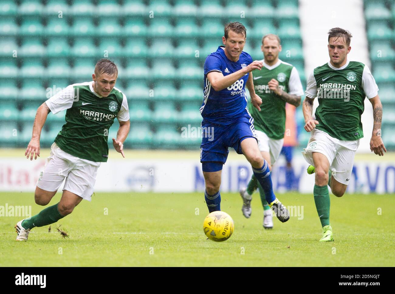 Hibernian's Scott Martin and Callum Crane chase after Birmingham City's ... Hibernian's Scott Martin and Callum Crane chase after Birmingham City's ...