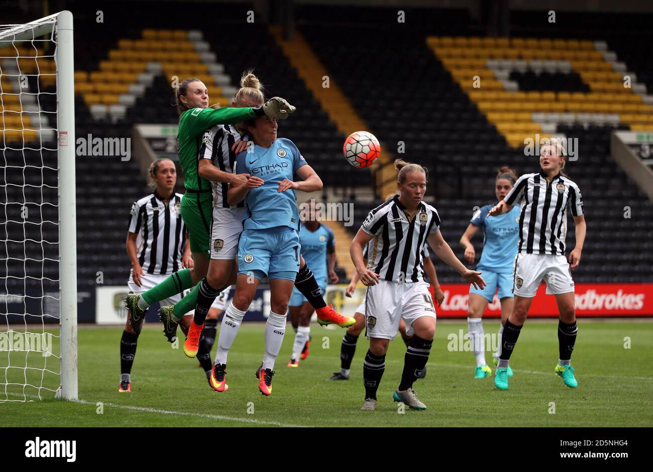 Notts County's goalkeeper Megan Walsh punches clear under pressure ...