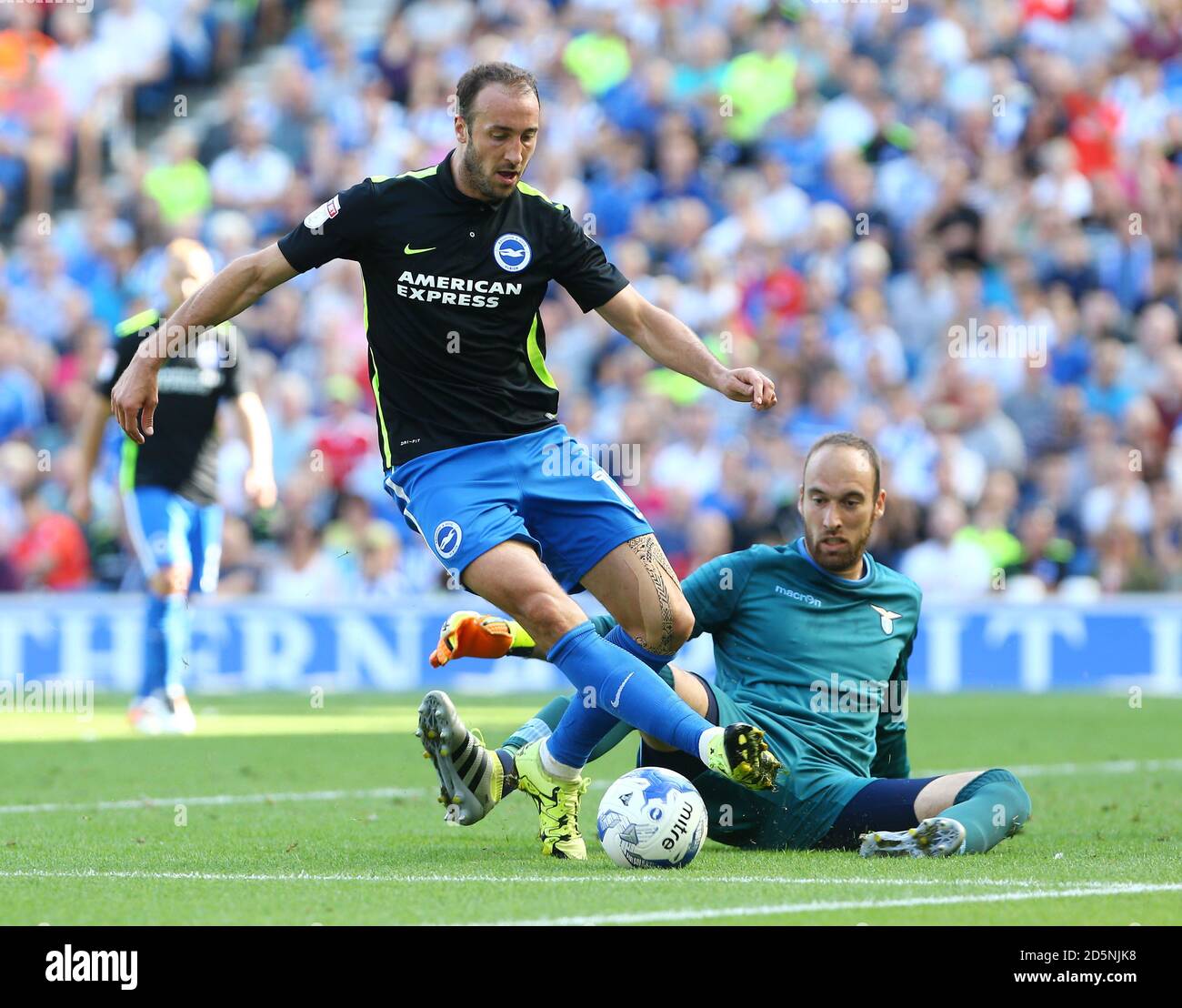 Brighton's Glenn Murray (left) is challenged by Lazio's Ivan Vargic ...