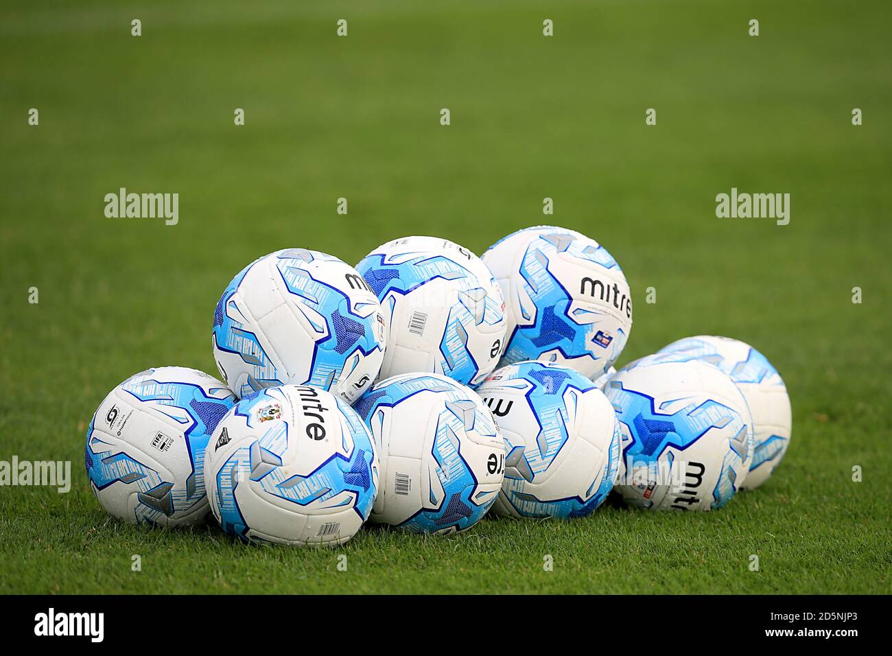 Mitre footballs on the pitch prior to the match Stock Photo - Alamy