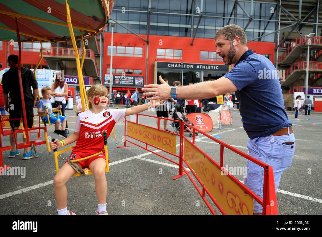 Charlton Athletic fans on the swing ride during the Family Fun Day in ...