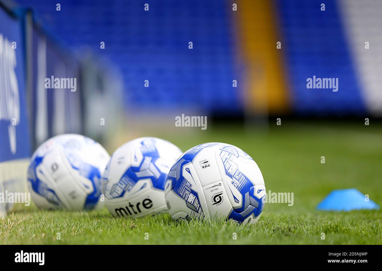 Mitre footballs on the pitch Stock Photo - Alamy
