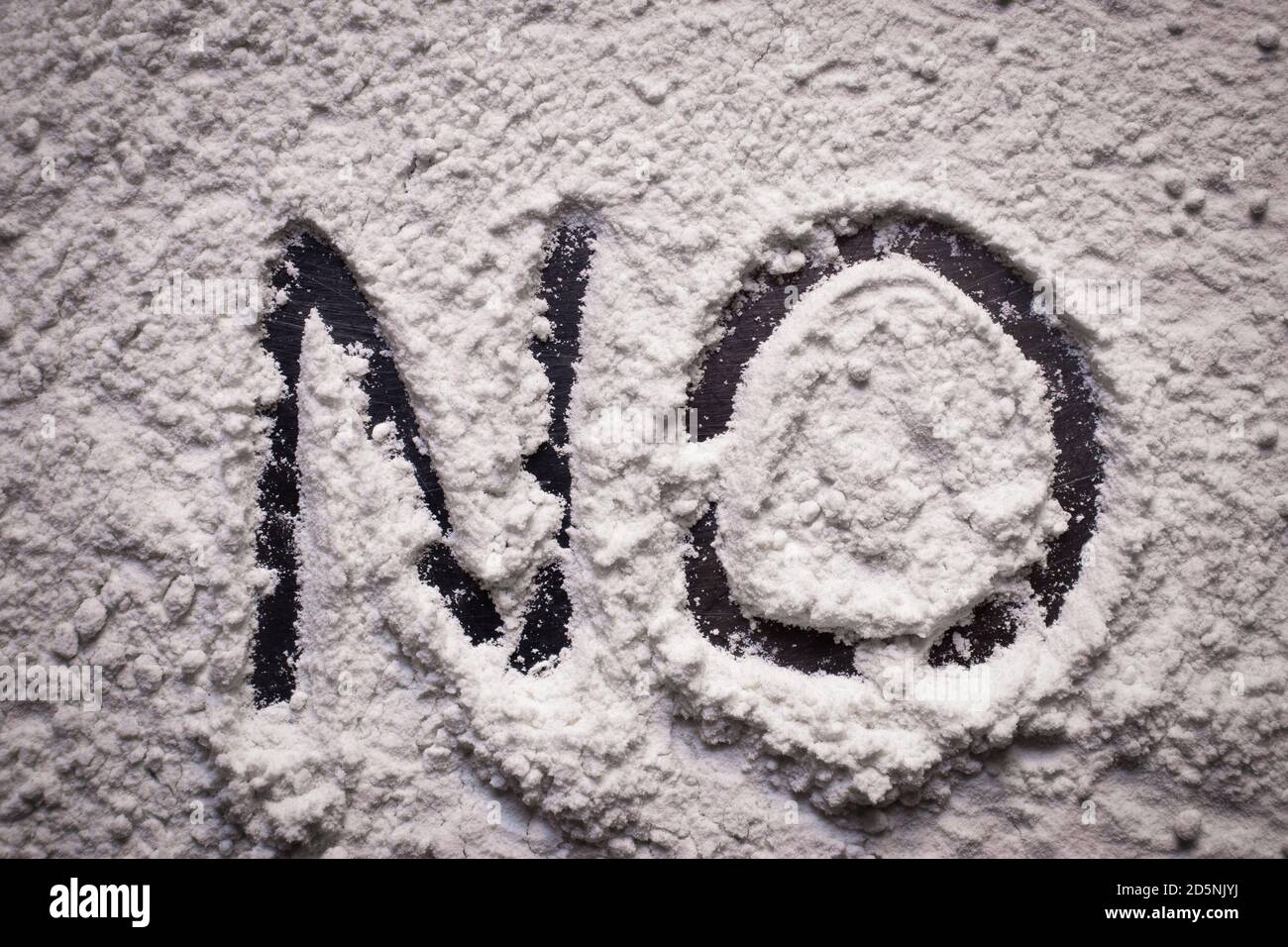 Word No written in white flour powder, concept of saying no to drug ...