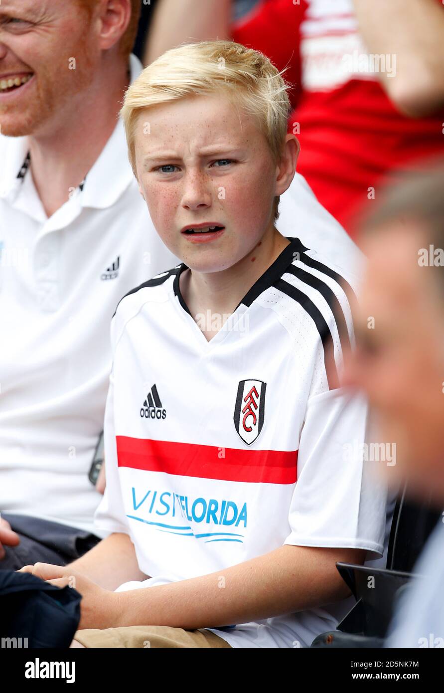 Fulham fans in the stands Stock Photo - Alamy