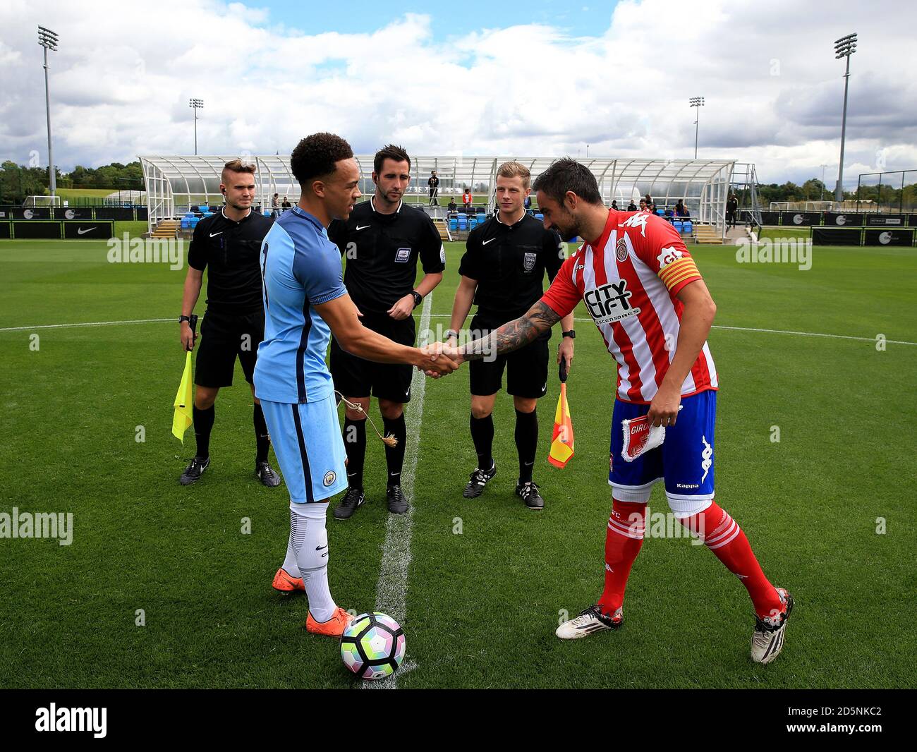 Manchester City captain Shay Facey shakes hands with Girona captain ...