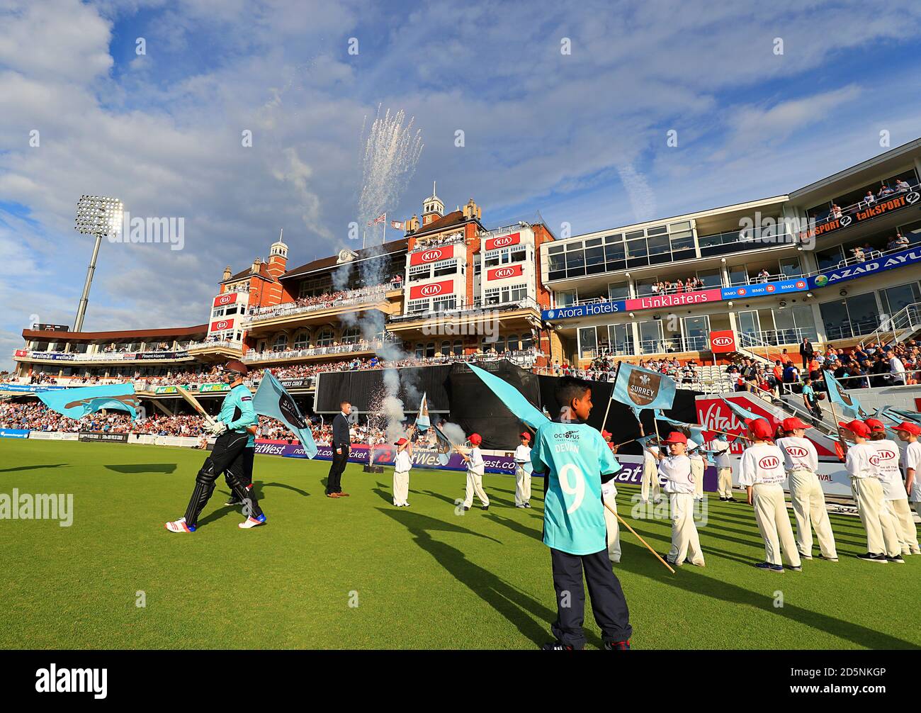 Surrey and Kent players head out onto the pitch Stock Photo - Alamy