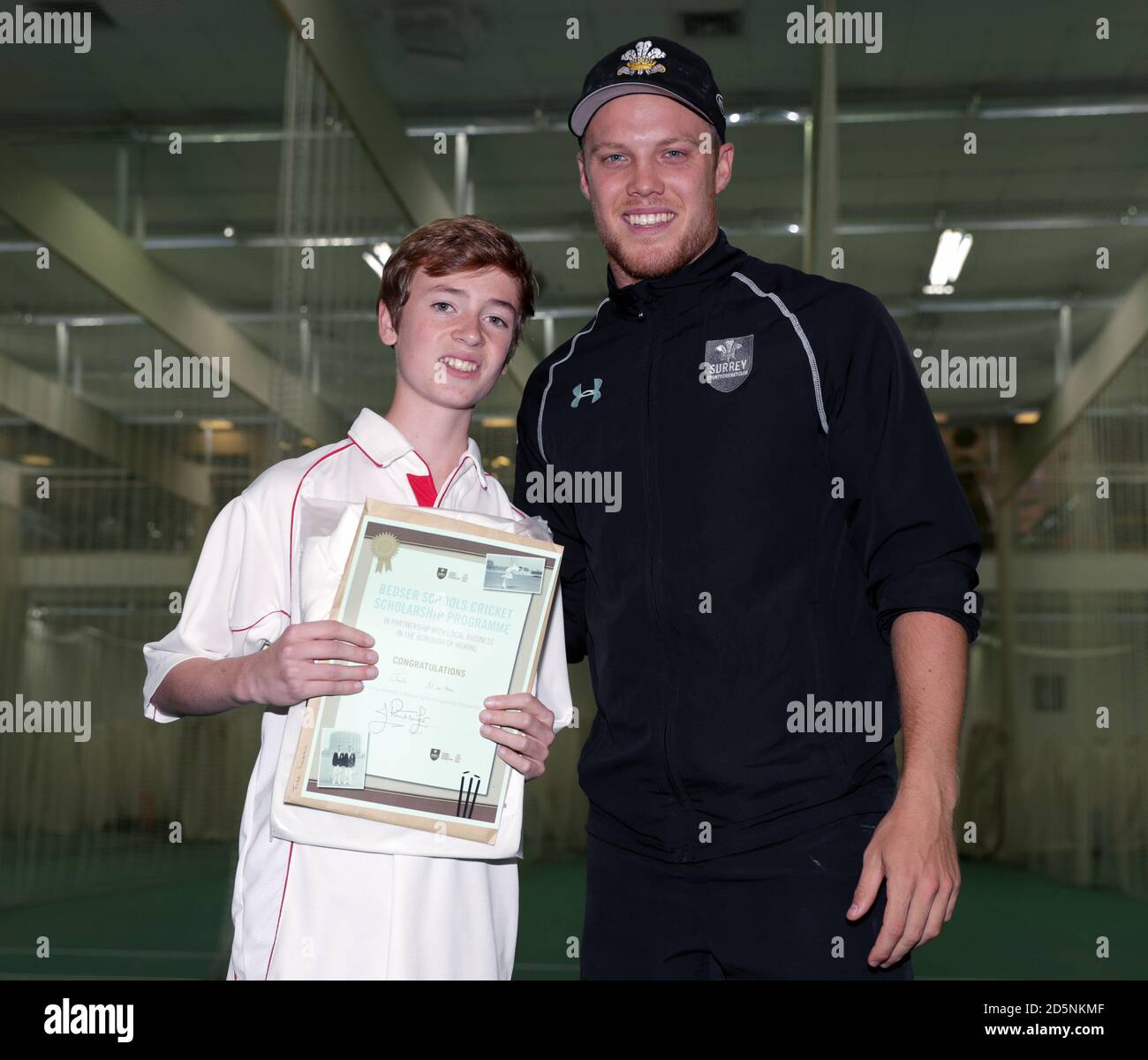 Surrey's Matt Dunn poses with a Bedser School Cricket scholarship Award ...