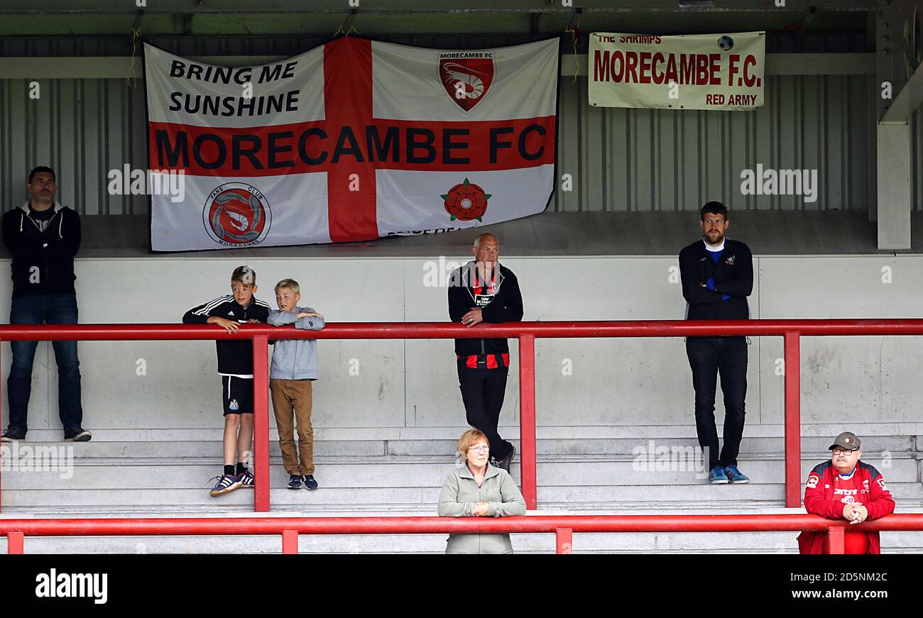 Morecambe FC fans in the stands Stock Photo - Alamy