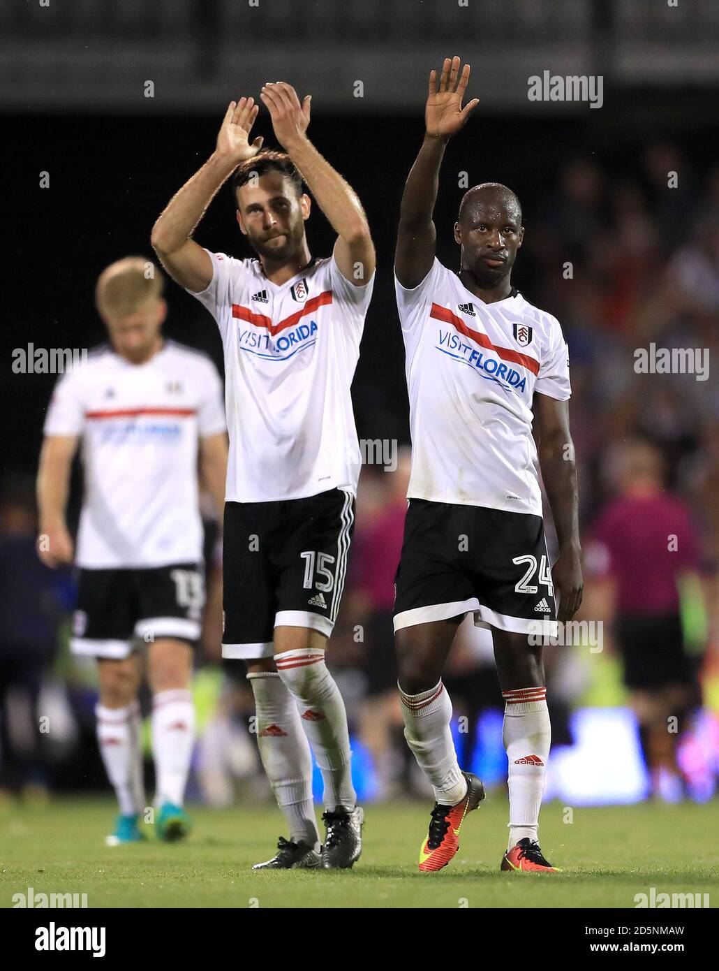 Fulham's Michael Madl (left) and Sone Aluko applaud the fans after the ...