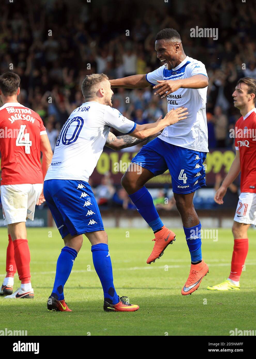 Bury's Kelvin Etuhu (right) celebrates with team-mate Danny Mayor after ...