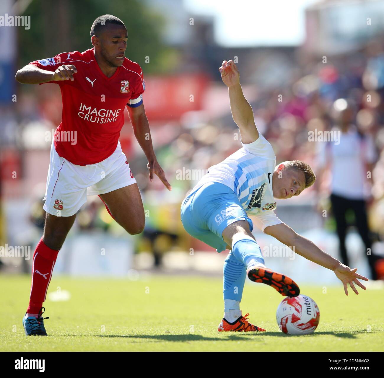 Swindon Town's Nathan Thompson and Coventry City's George Thomas Stock ...