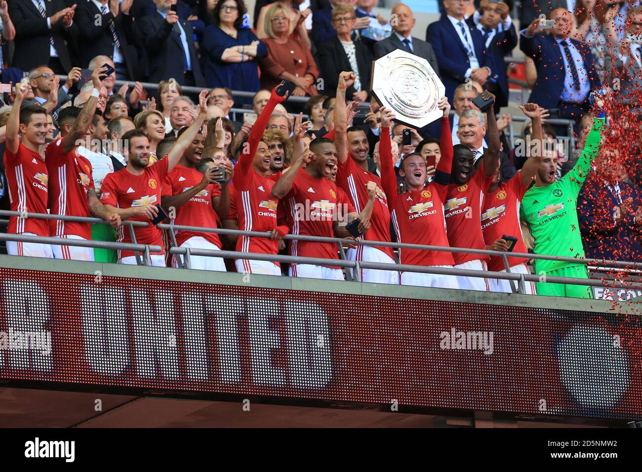 Manchester United players celebrate with the Community Shield trophy ...
