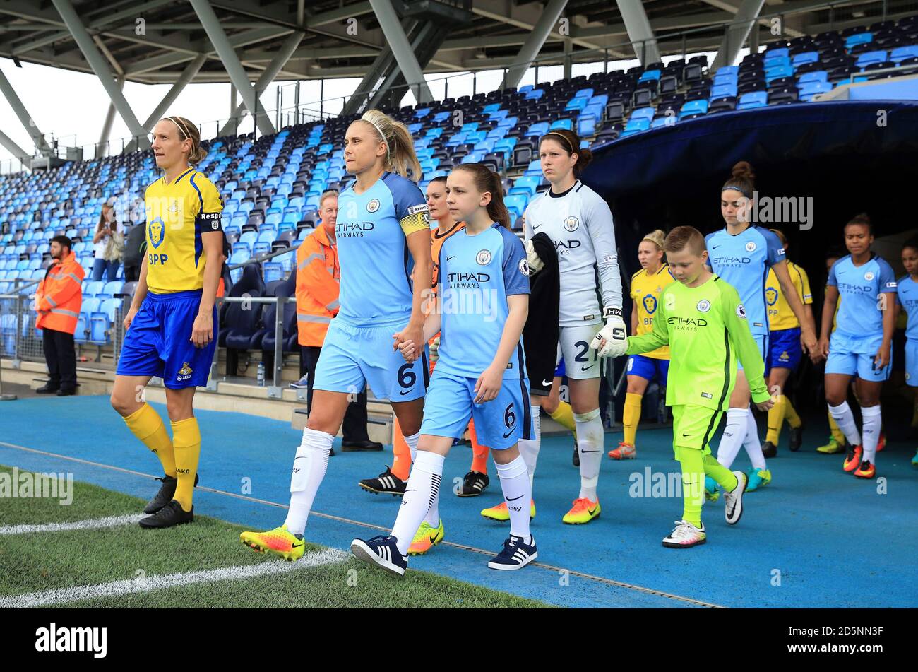 Manchester City Women's team with their match day mascots Stock Photo ...