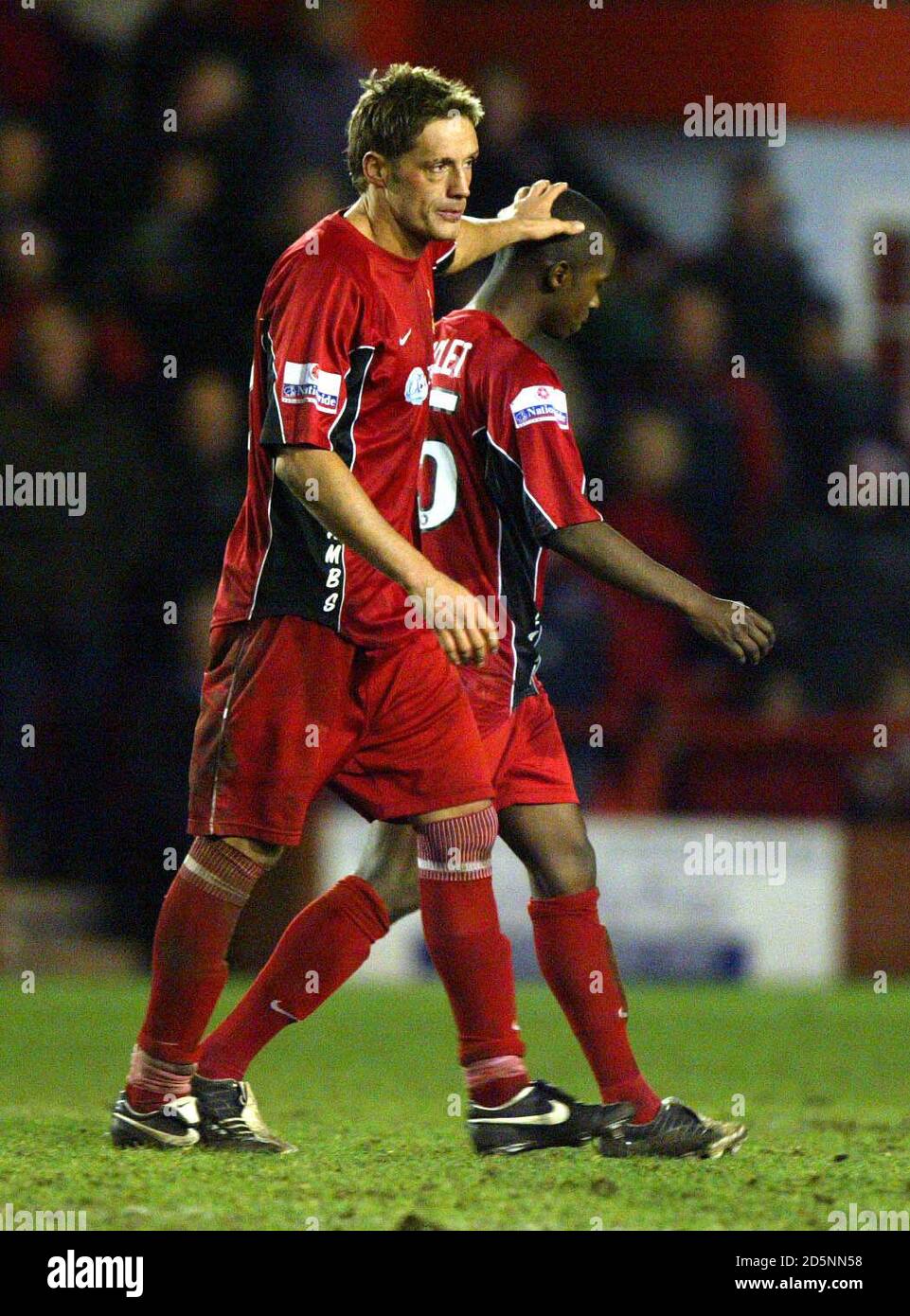 Tamworth's Carl Heggs consoles Eddie Anaclet after his penalty miss ...