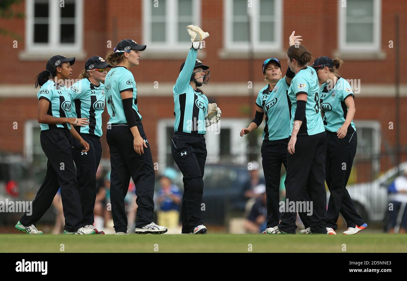 Surrey Stars players celebrates as Lancashire Thunder Eleanor Threlkeld ...
