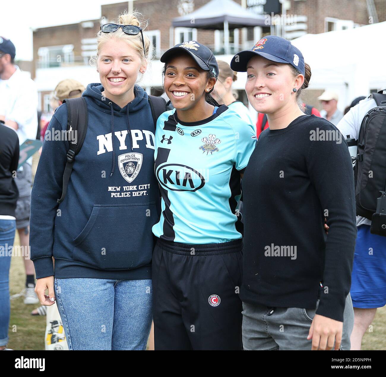 Surrey's Cordelia Griffith poses for photos with fans after the game ...