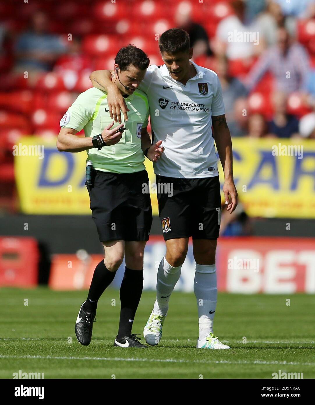Northampton Town's Alex Revell with referee Darren England Stock Photo ...