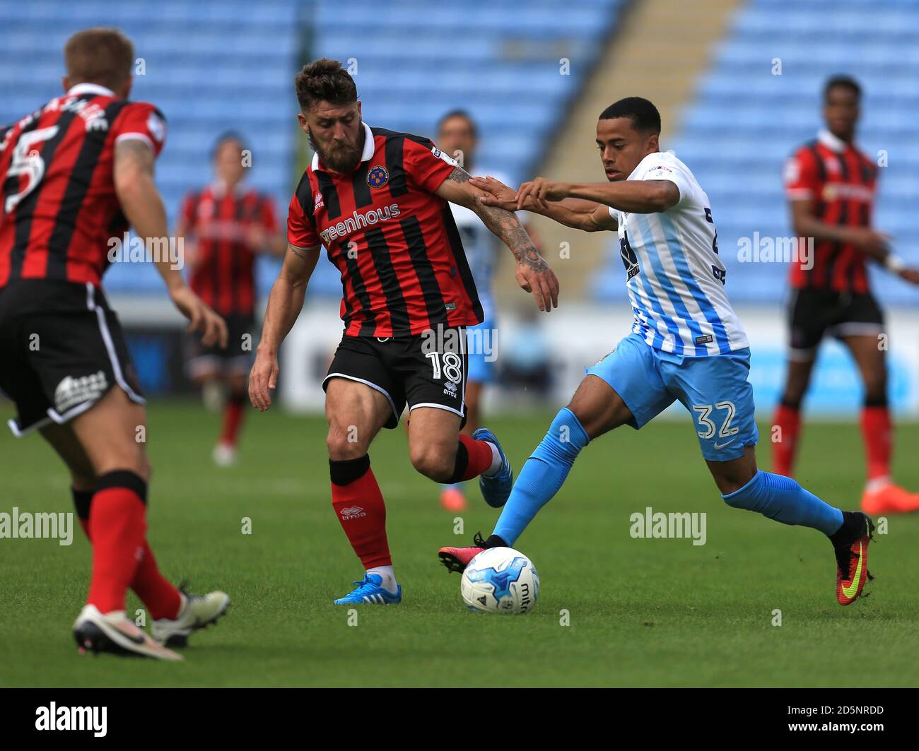 Coventry City's Kyle Spence (right) tries to drift past Shrewsbury Town ...