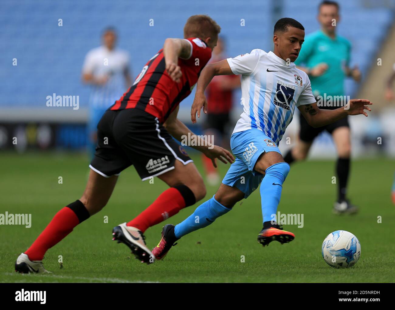 Coventry City's Kyle Spence (right) tries to drift past Shrewsbury Town ...
