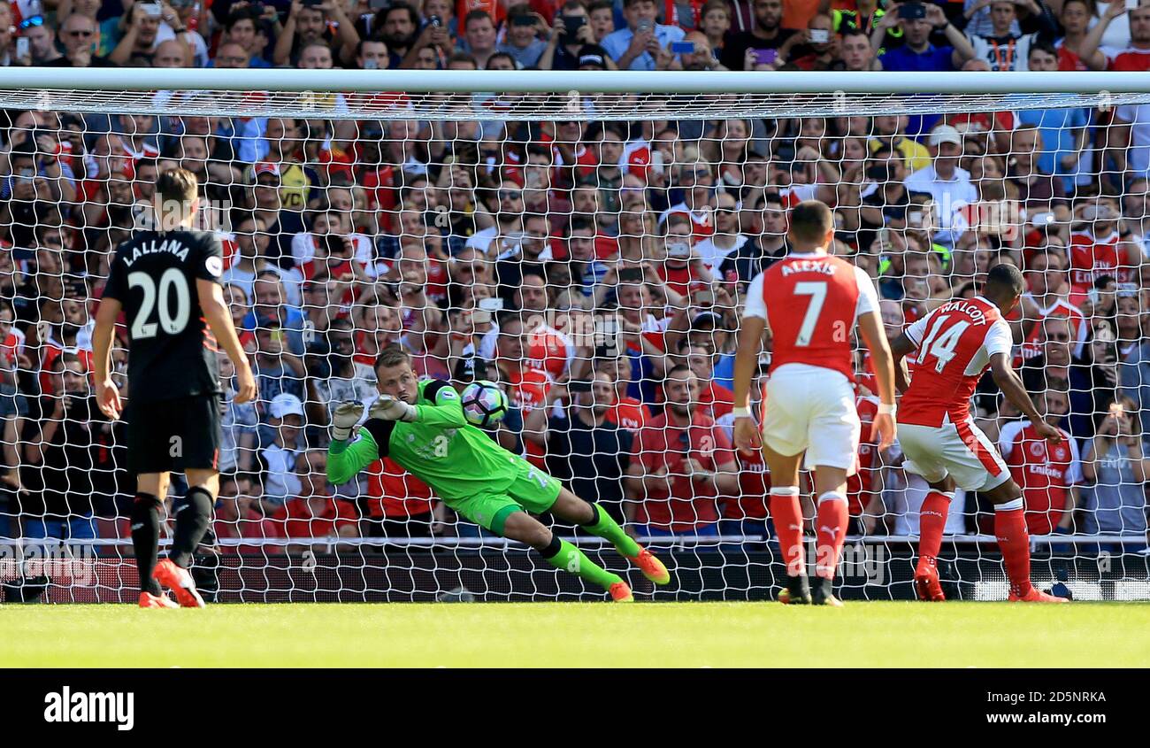 Arsenal's Theo Walcott (right) has a penalty saved by Liverpool ...