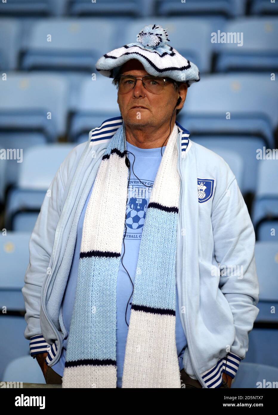 A Coventry City fan in the stands before the game Stock Photo - Alamy