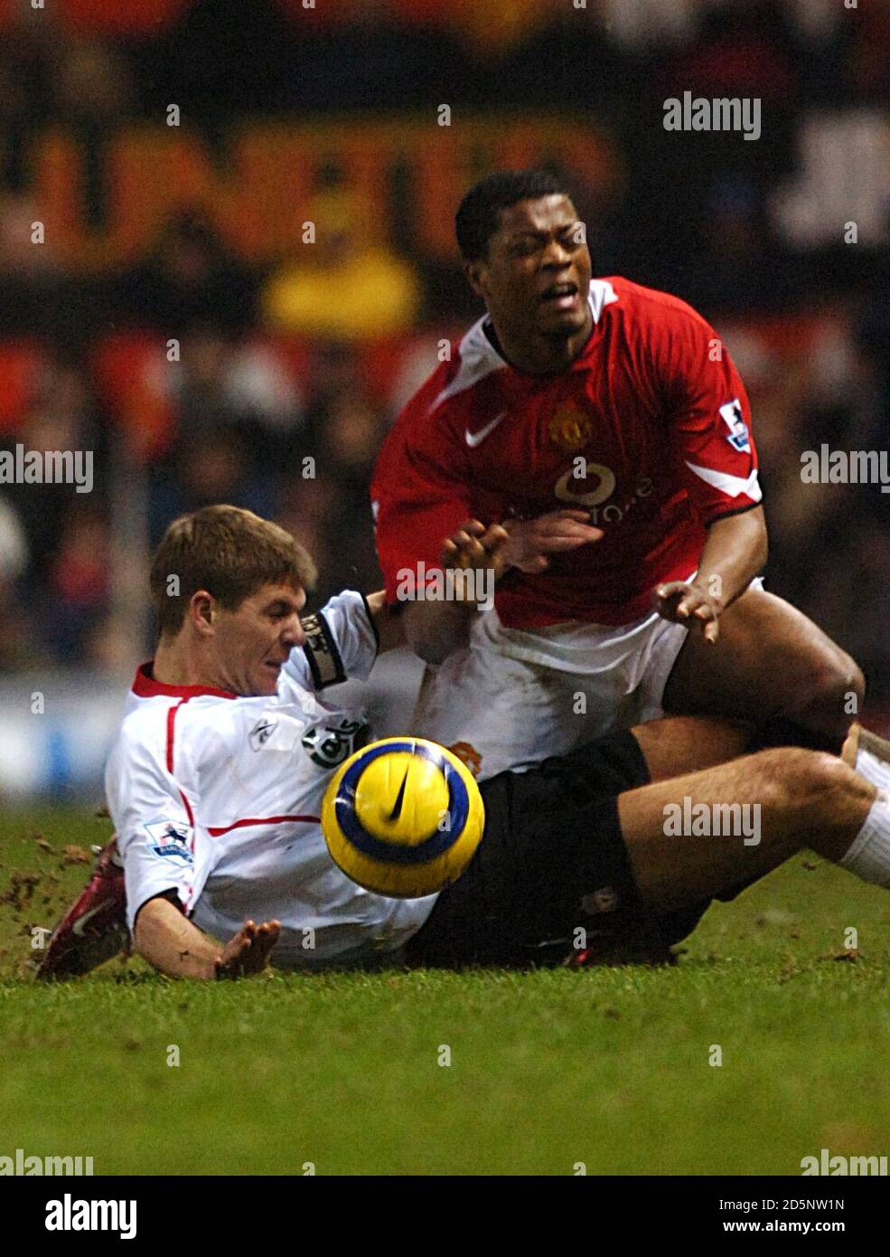 Manchester United's Patrice Evra feels the pain after a crunching ...