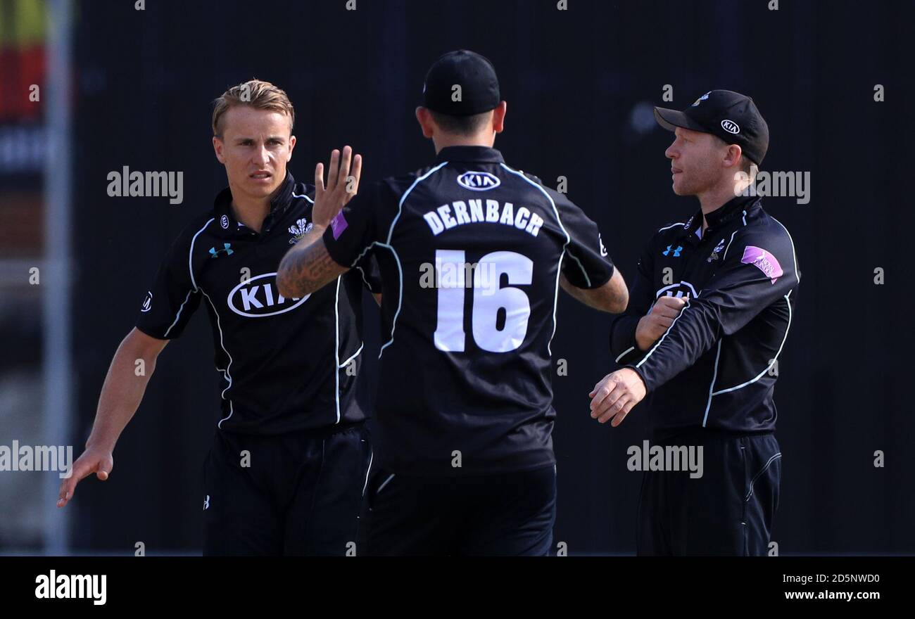 Surrey's Tom Curran, (left) celebrates with Jade Dernbach and Gareth ...