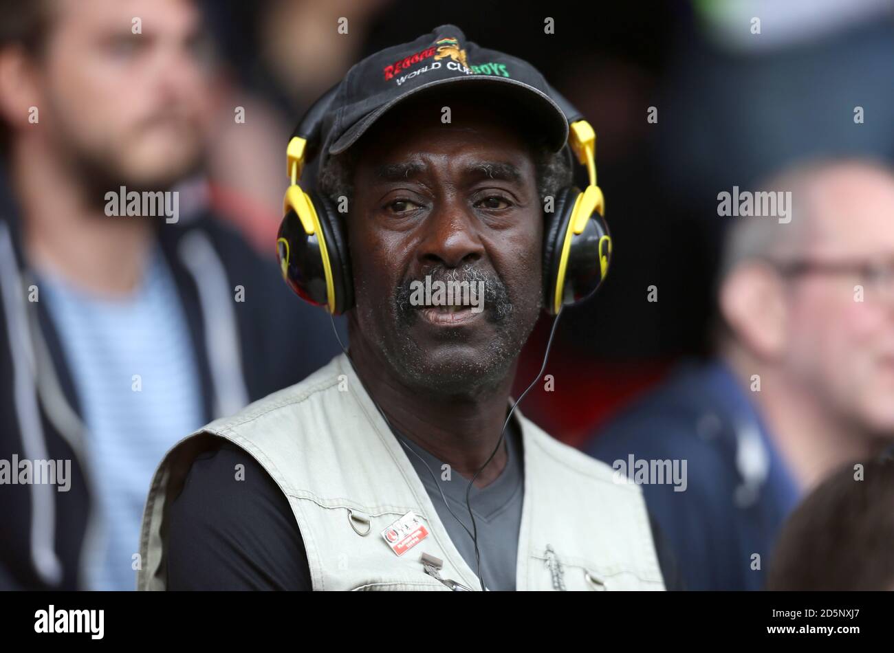 A Charlton Athletic fan wearing batman headphones in the stands Stock ...