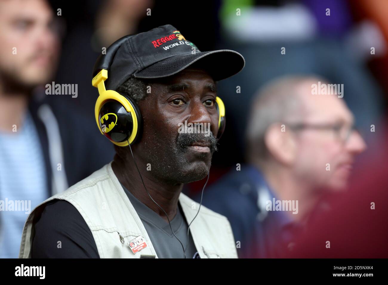 A Charlton Athletic fan wearing batman headphones in the stands Stock ...