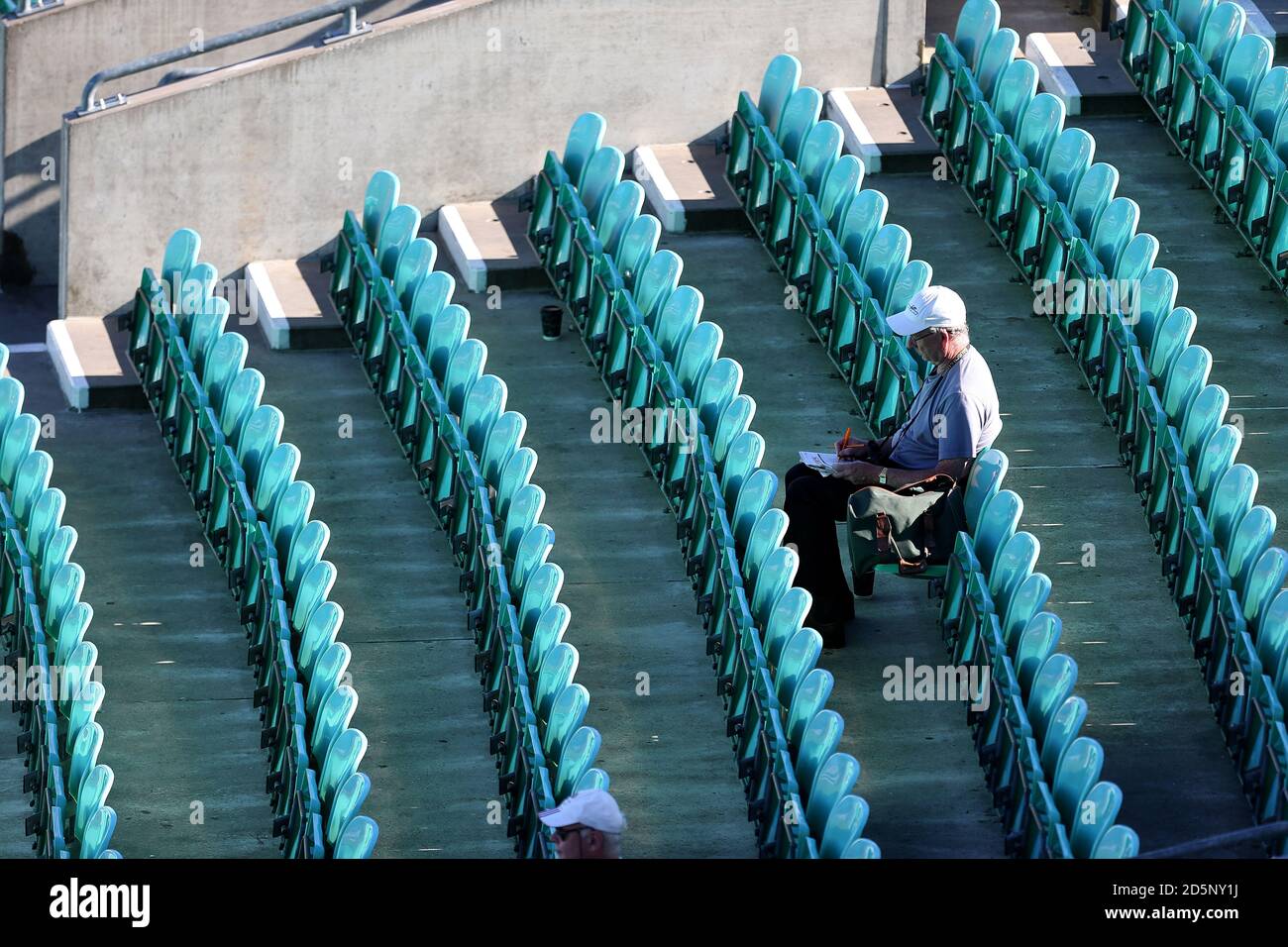 General view of spectator marking down the score during play Stock ...