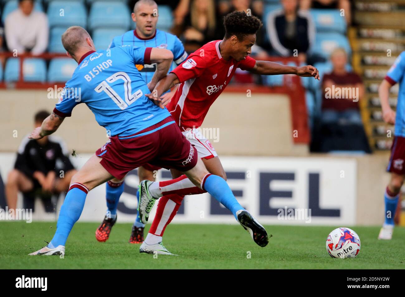 Scunthorpe United's Neil Bishop challenges Bristol City's Bobby Reid ...