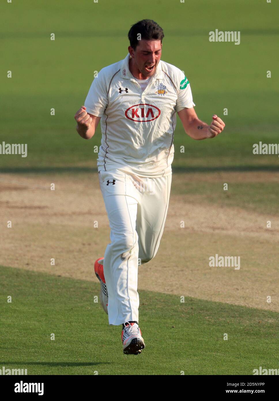 Surrey's Mark Footitt celebrates taking the wicket of Lancashire's ...
