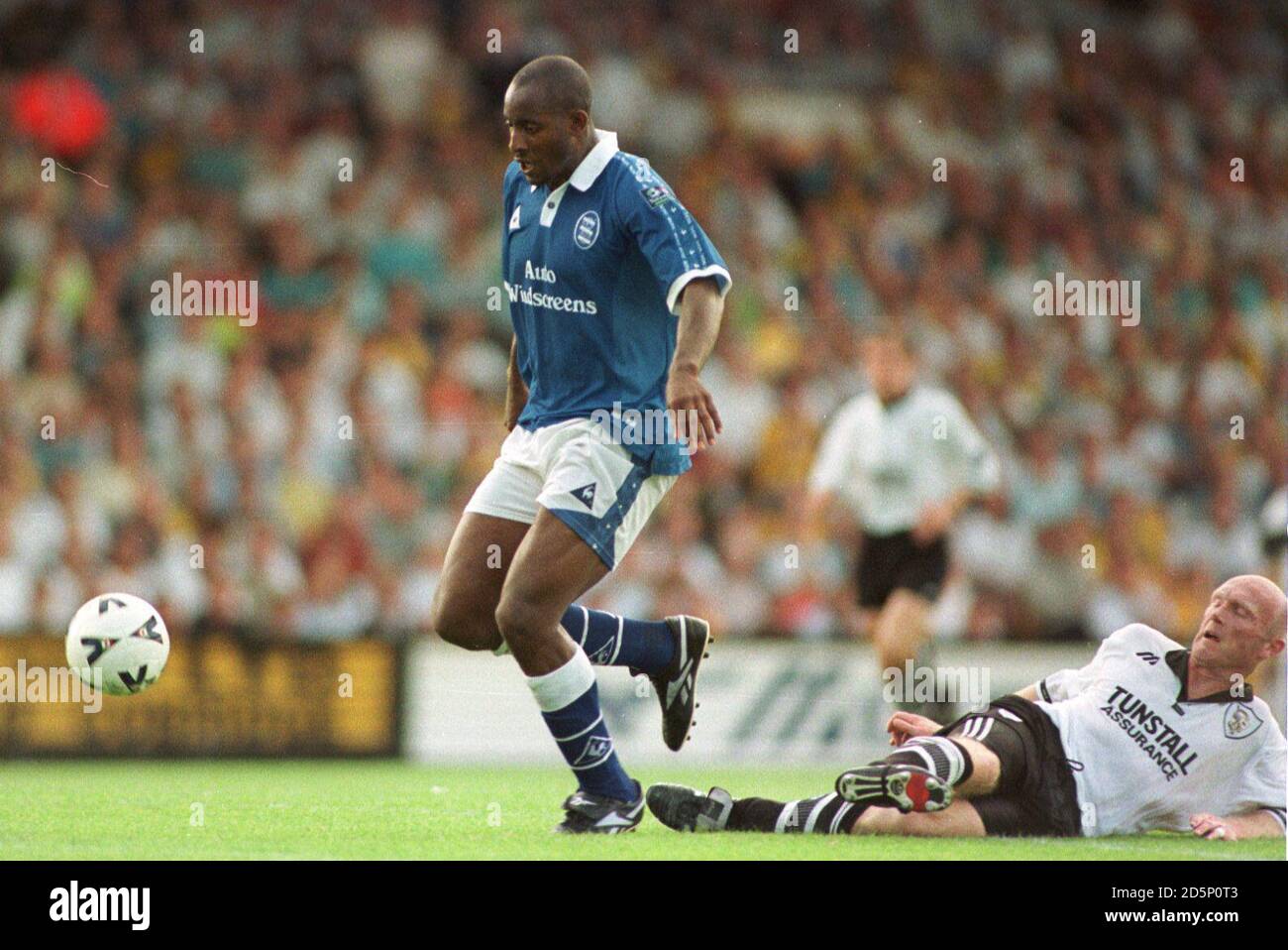 Dele Adebola of Birmingham City (left) gets away from Port Vale's Neil ...
