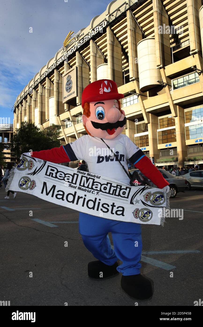 A Real Madrid mascot poses outside Santiago Bernabeu prior to the game ...