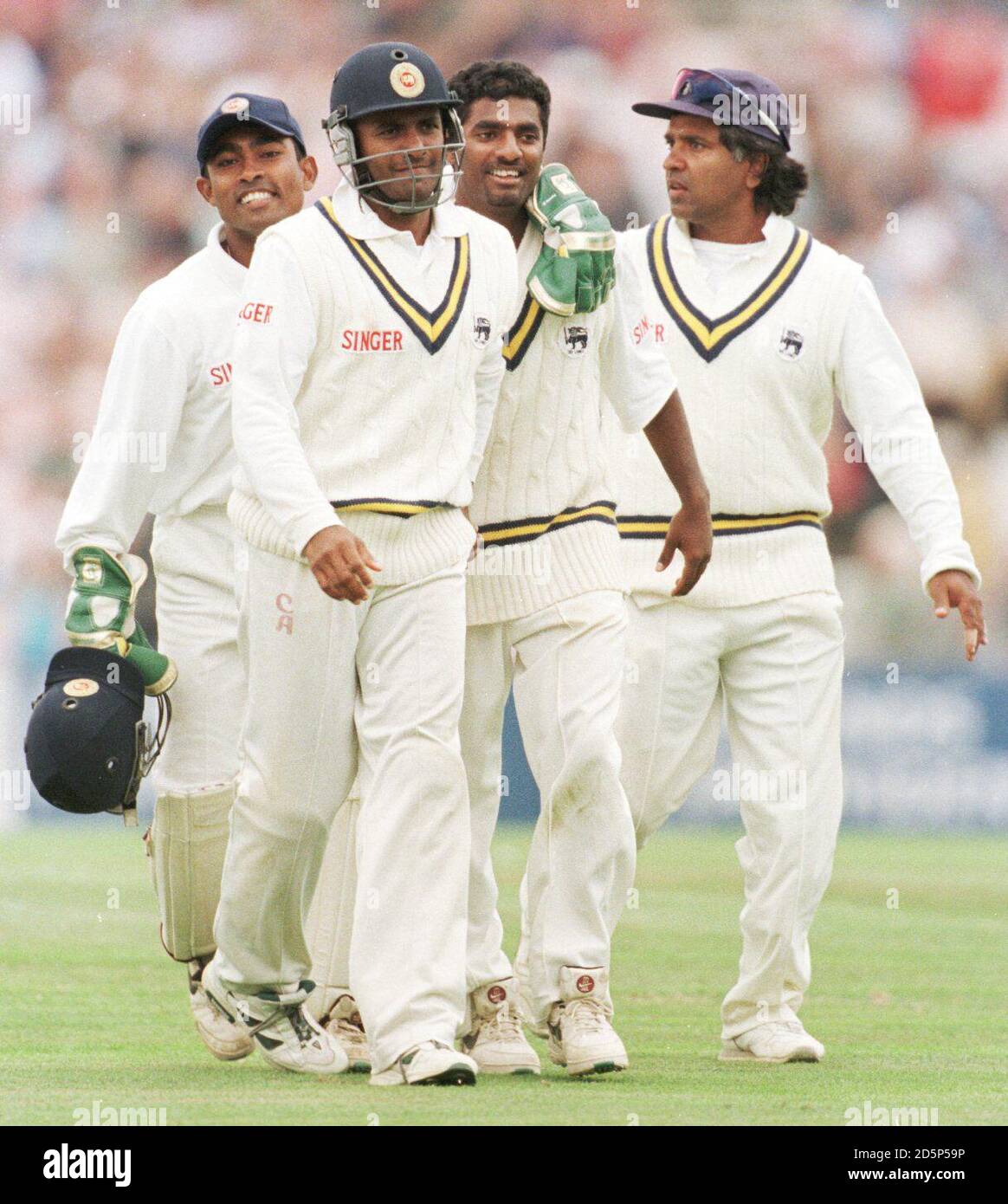 Sri Lanka's Muthiah Muralitharan's (centre) celebrates his nine wickets ...